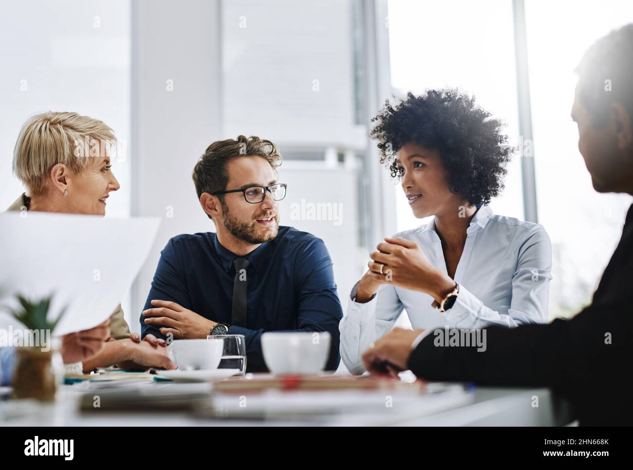 Group executives sitting working together hi-res stock photography and ...