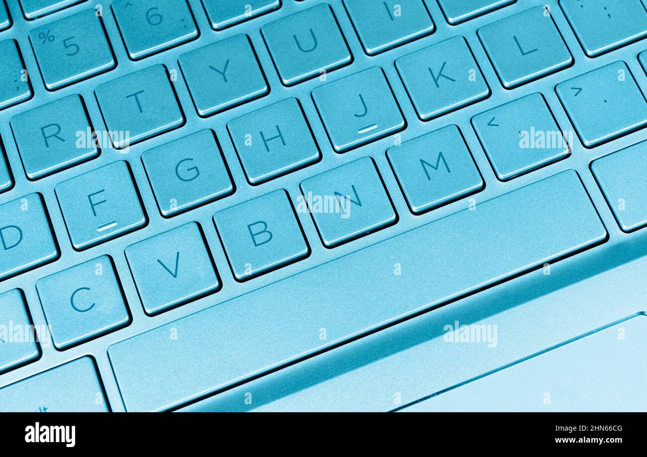 Closeup of a modern blue computer keyboard keys. Close up view of a ...
