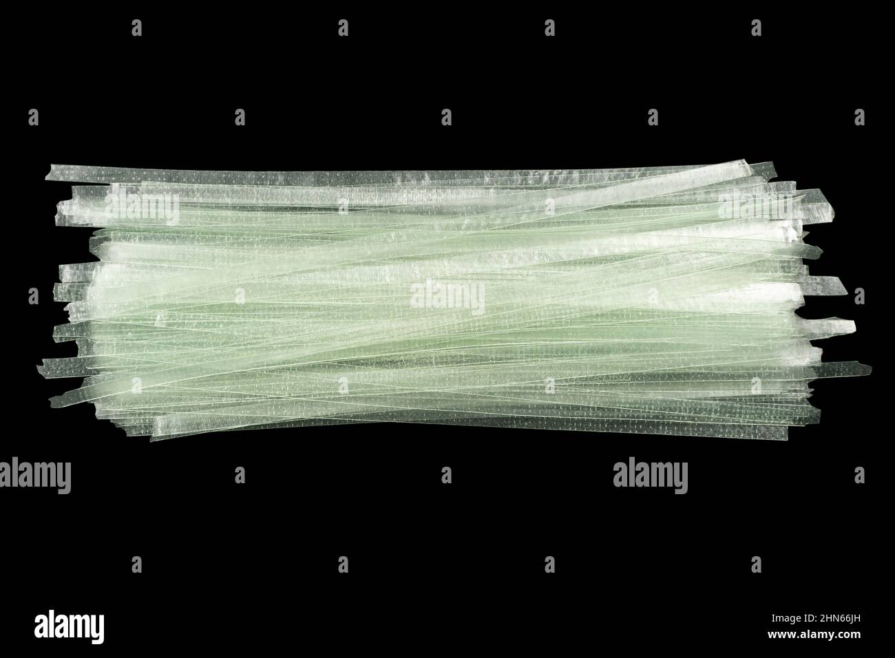 Green bean noodles isolated on black background. Raw funchose. Glass ...