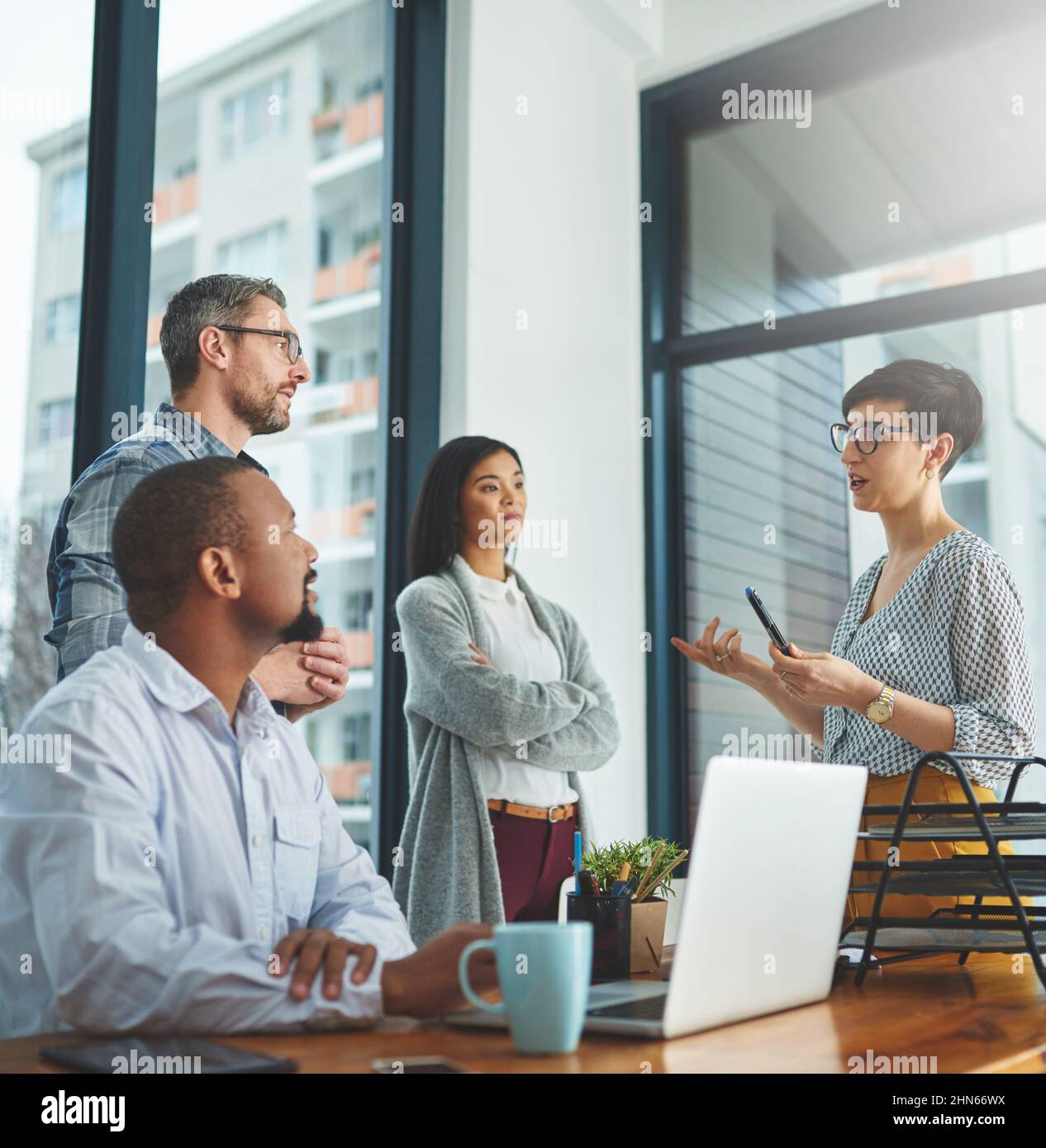 Working together to get the task done. Shot of businesspeople working ...