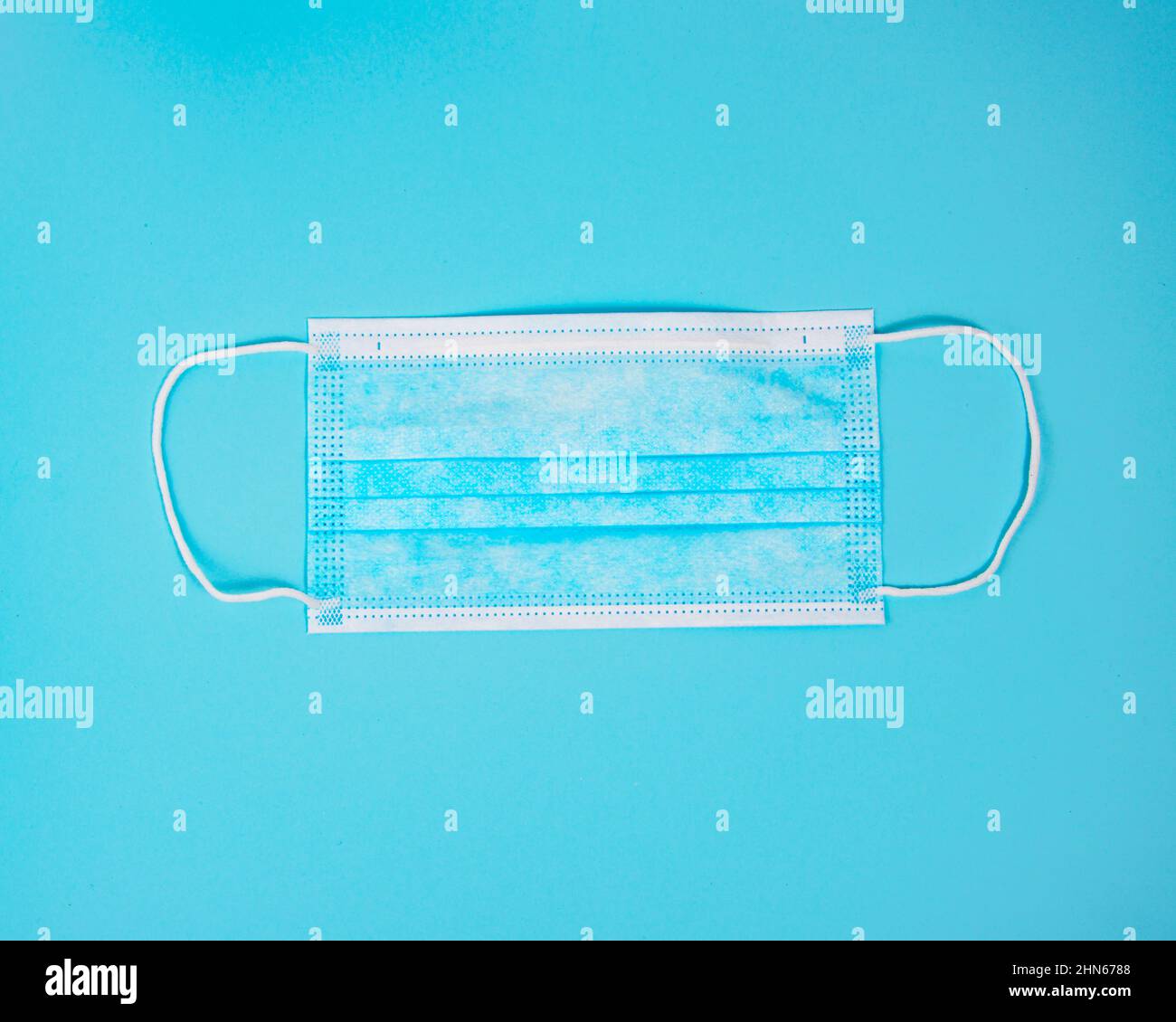 Medical breath clinic filter mask on blue background Stock Photo - Alamy