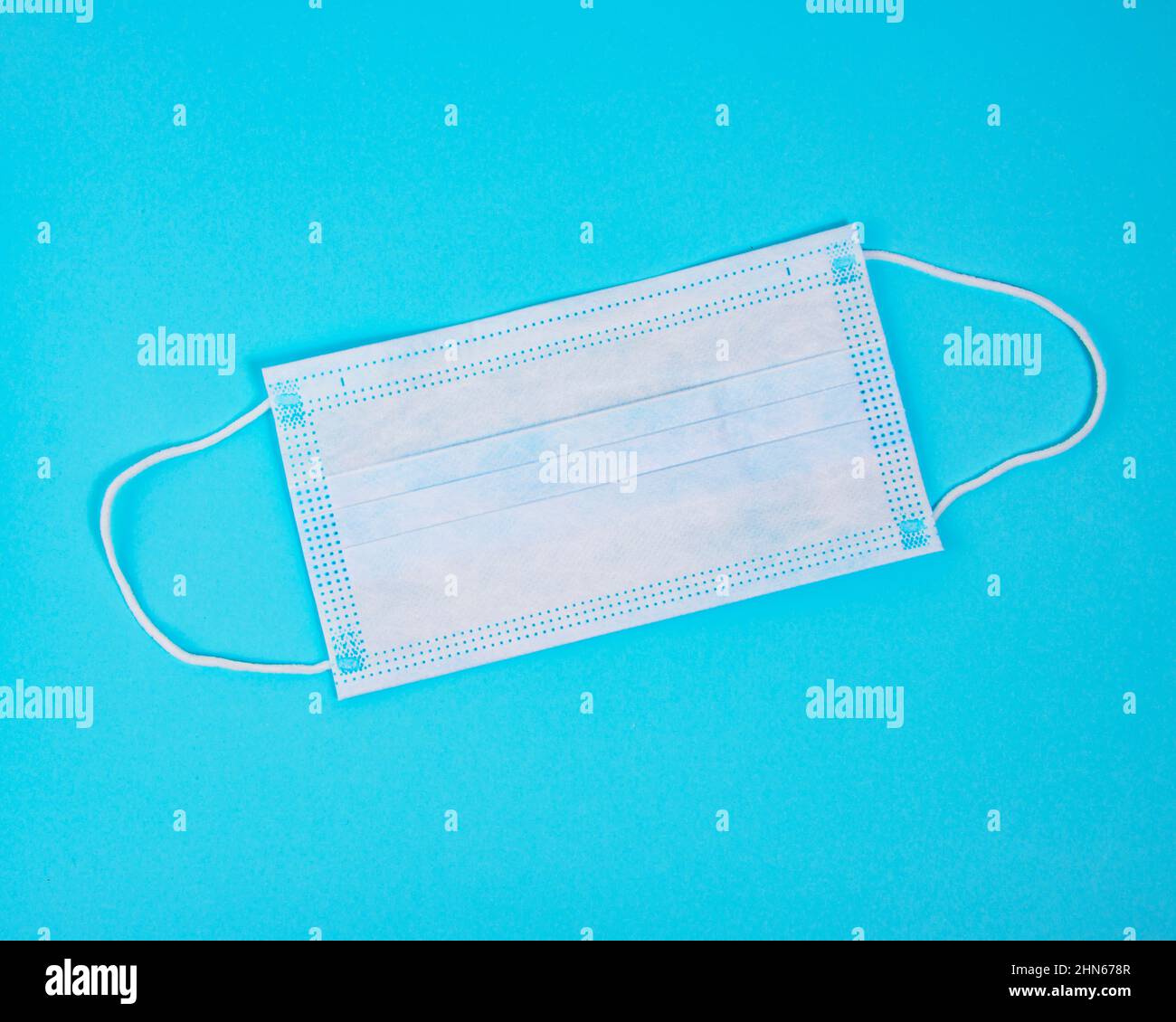 Medical breath clinic filter mask on blue background Stock Photo - Alamy
