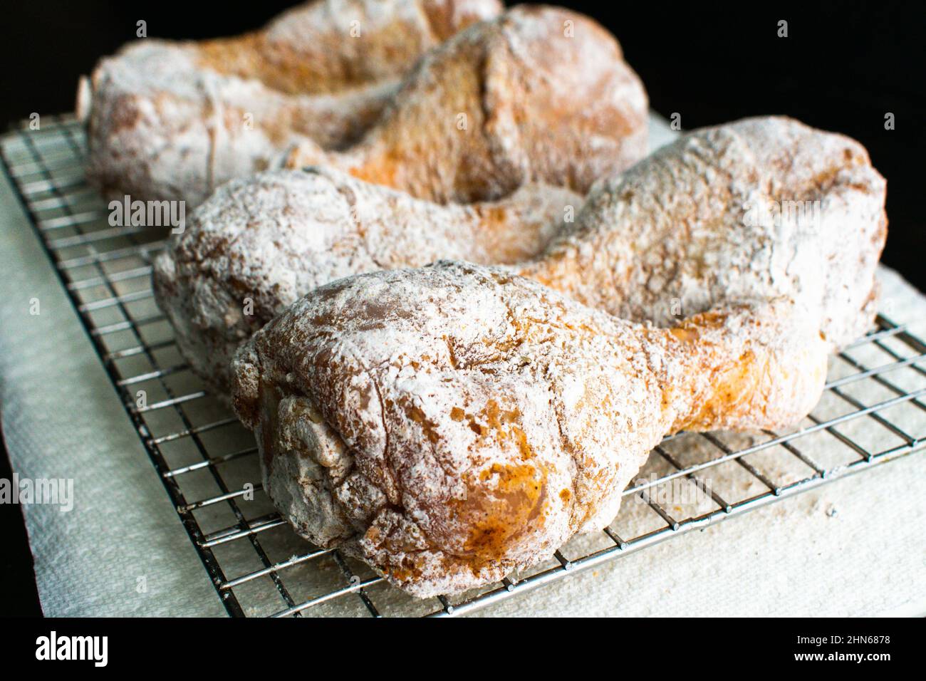 Raw Breaded Chicken Drumsticks on a Wire Rack: Breaded uncooked chicken ...