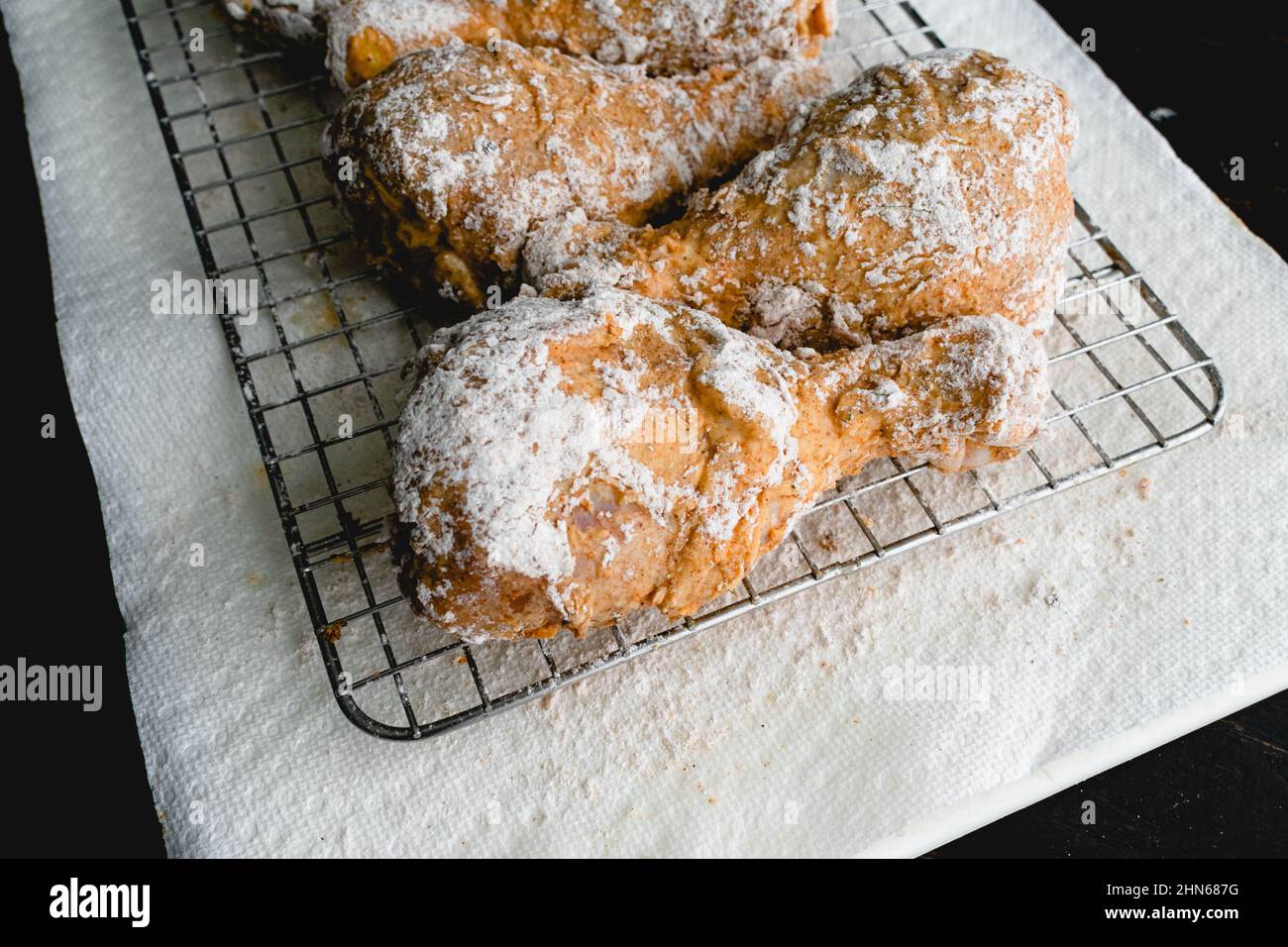 Raw chicken being breaded hi-res stock photography and images - Alamy