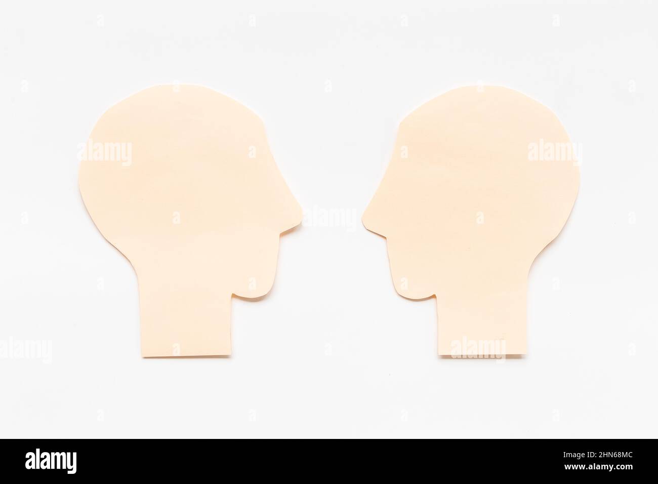 Social communication and connection concept with two paper human heads ...