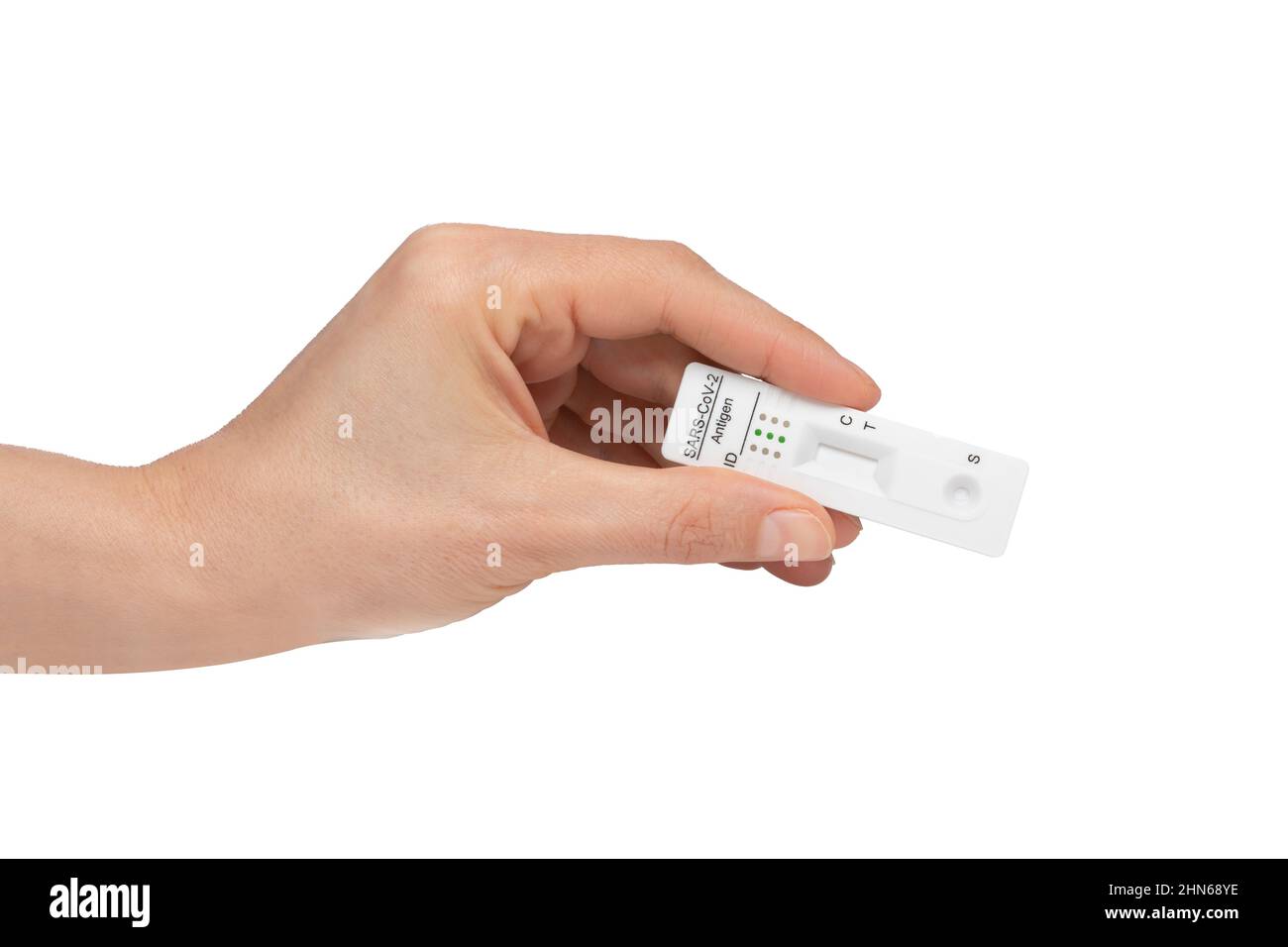 Woman hand holding a SARS Covid 19 antigen rapid test on clean white ...
