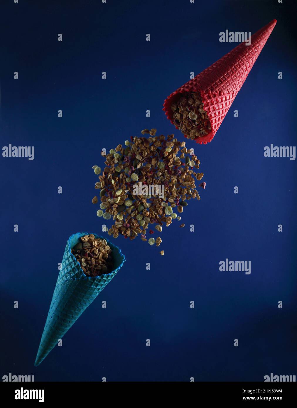 red and blue waffle cones and granola isolated on blue background flat ...