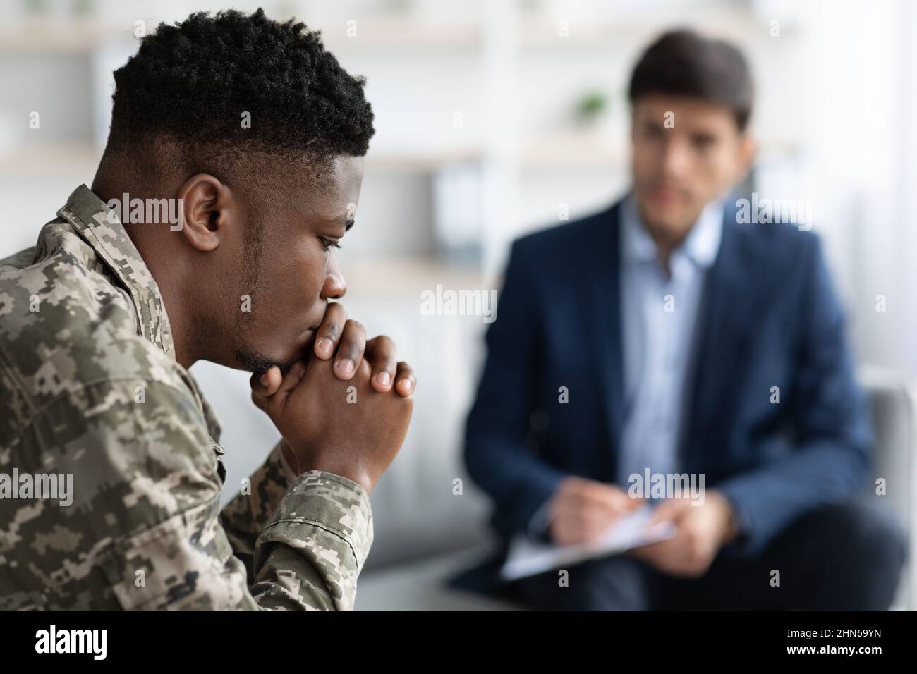 Pensive black soldier having conversation with social worker Stock ...