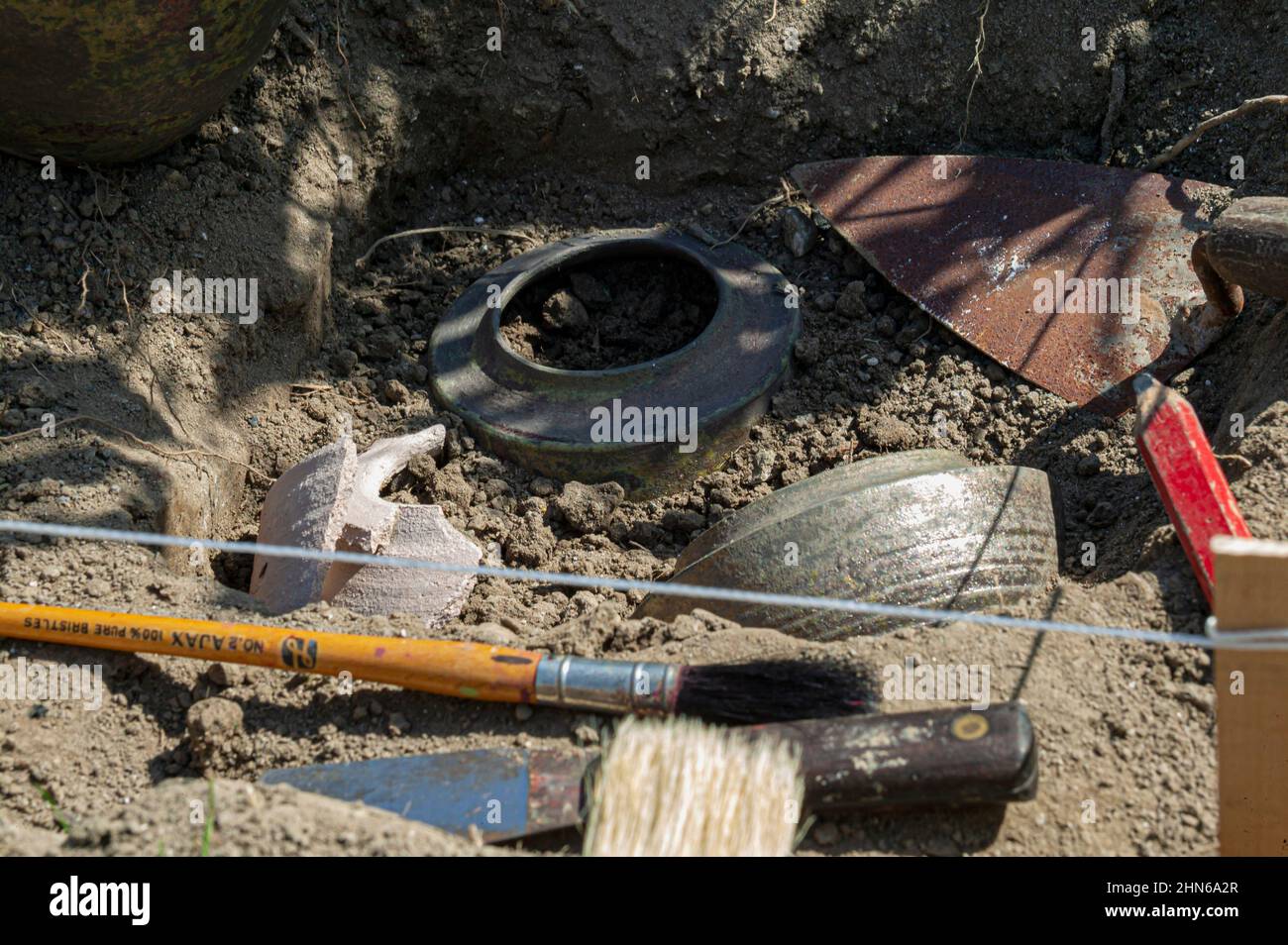 Pottery discovery while digging in the garden Stock Photo - Alamy
