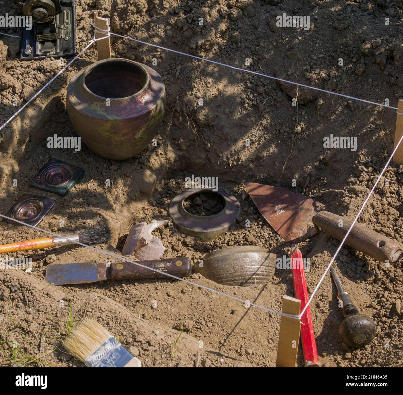 Pottery discovery while digging in the garden Stock Photo - Alamy