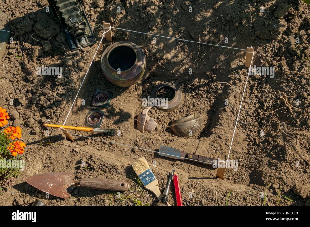 Pottery discovery while digging in the garden Stock Photo - Alamy