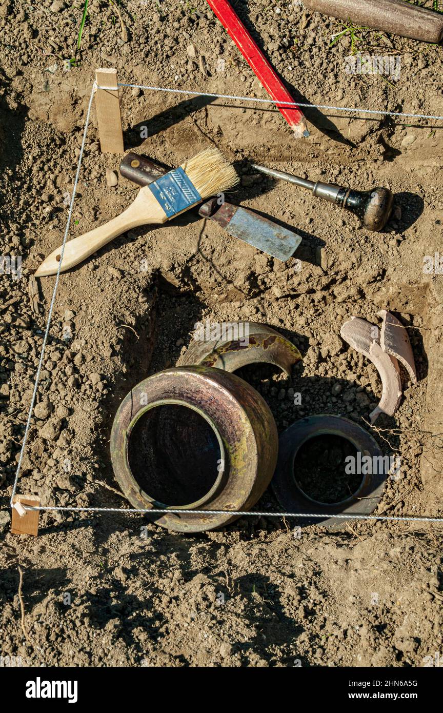 Pottery discovery while digging in the garden Stock Photo - Alamy
