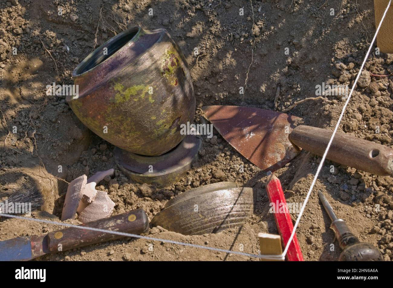 Pottery discovery while digging in the garden Stock Photo - Alamy