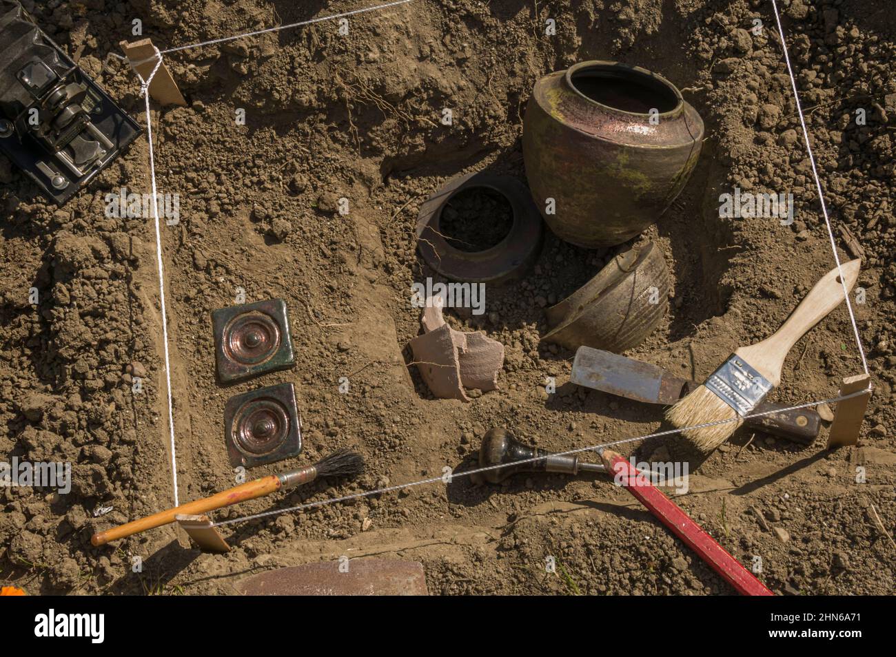 Pottery discovery while digging in the garden Stock Photo - Alamy