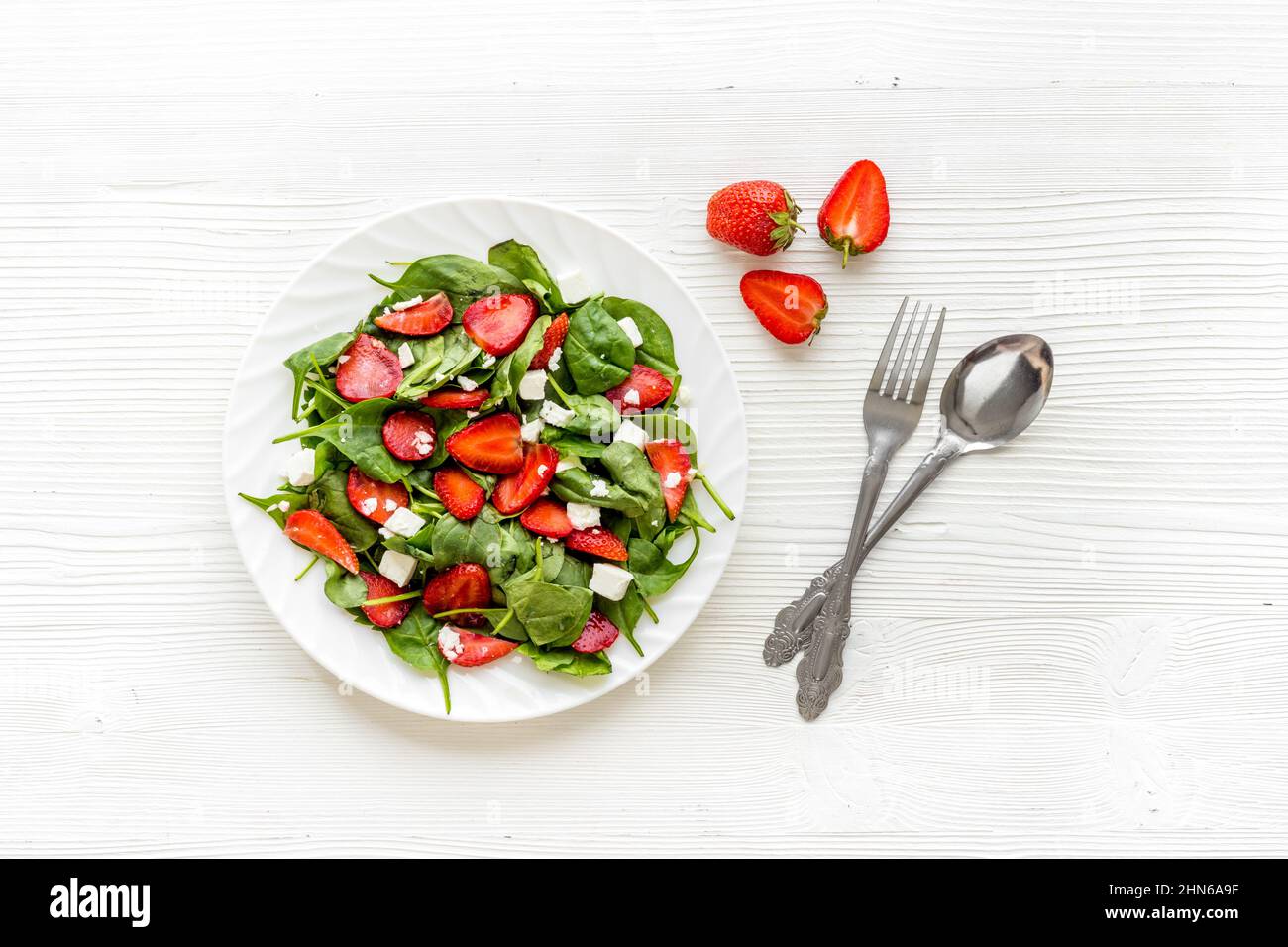Fresh fruit salad with spinach and strawberry. Healthy happy meal Stock ...