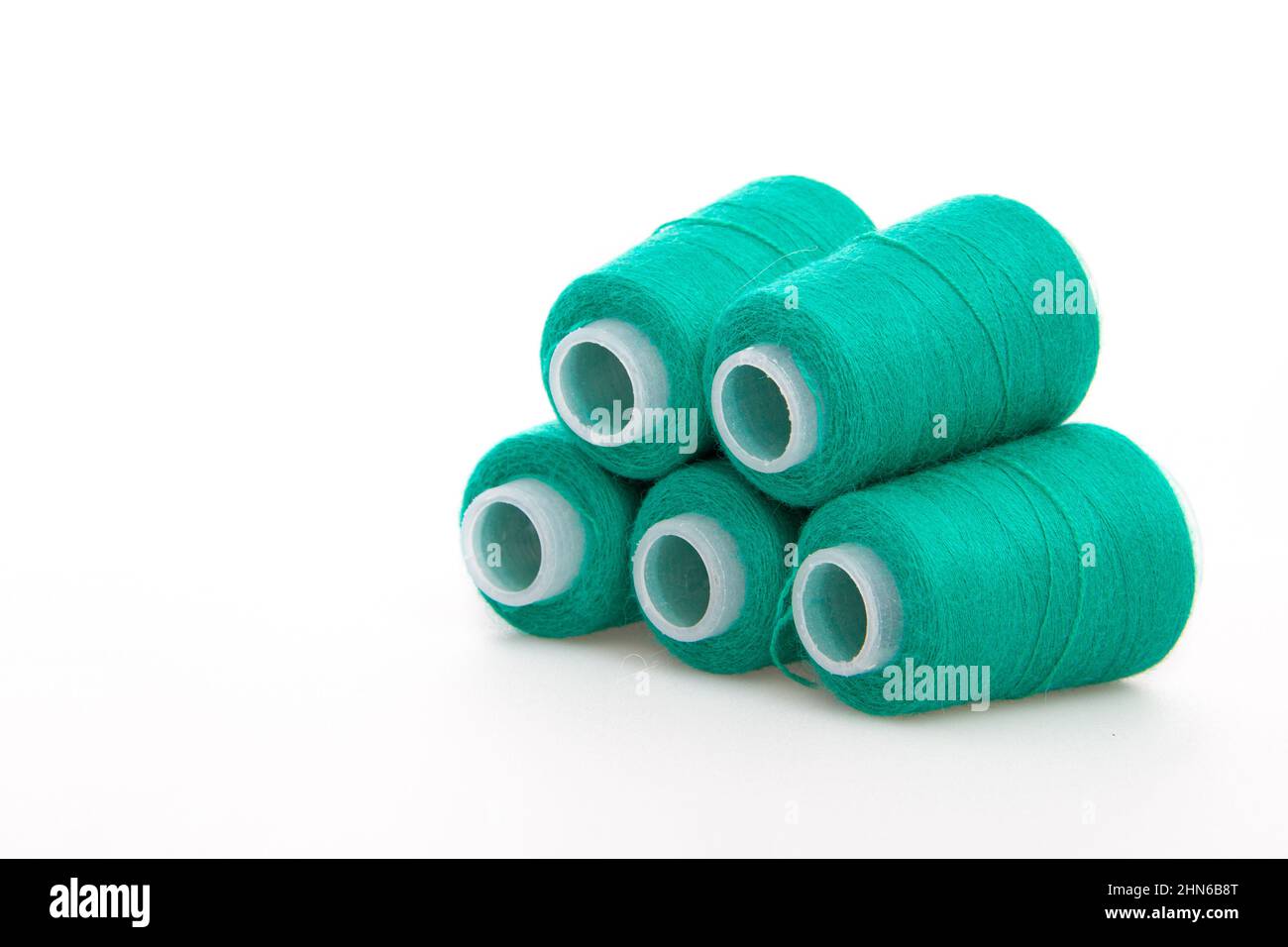 Green spool of thread isolated on white background. Skein of woolen ...
