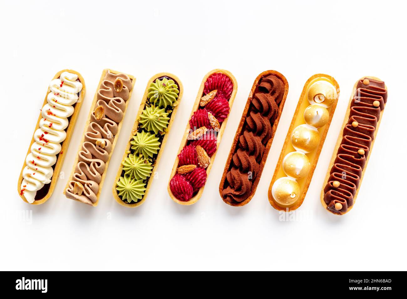 Sweet food pattern of eclairs with color topping. Sweet shacks Stock ...