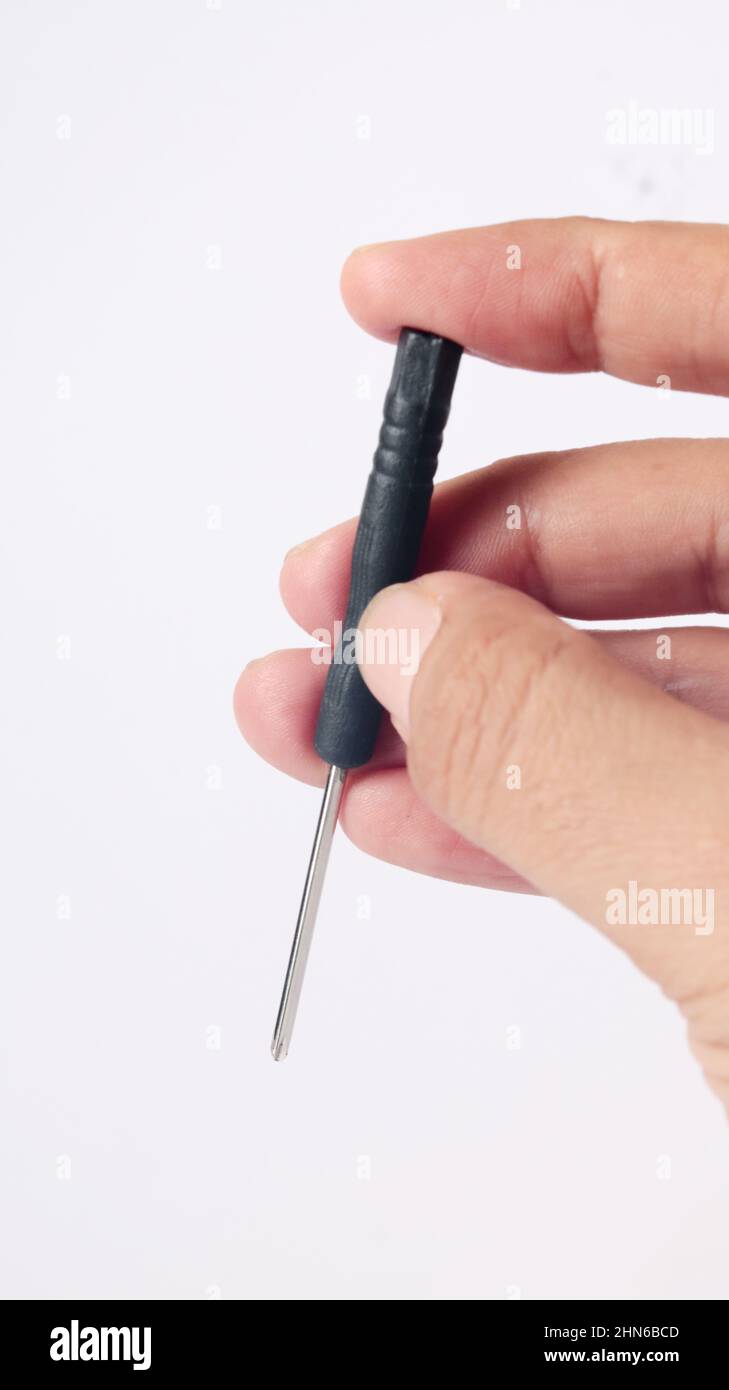 man hand holding a screwdriver, isolated on white background Stock ...