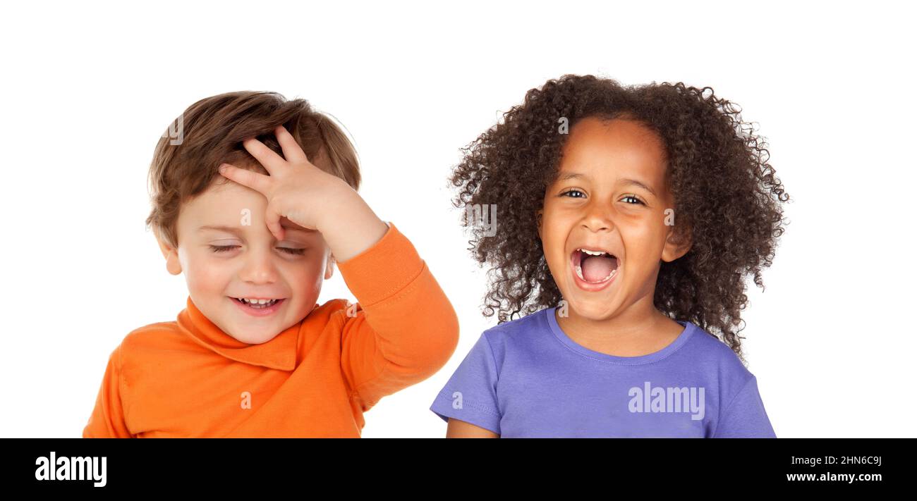 Two children doing hand gestures and laughing isolated on a white ...