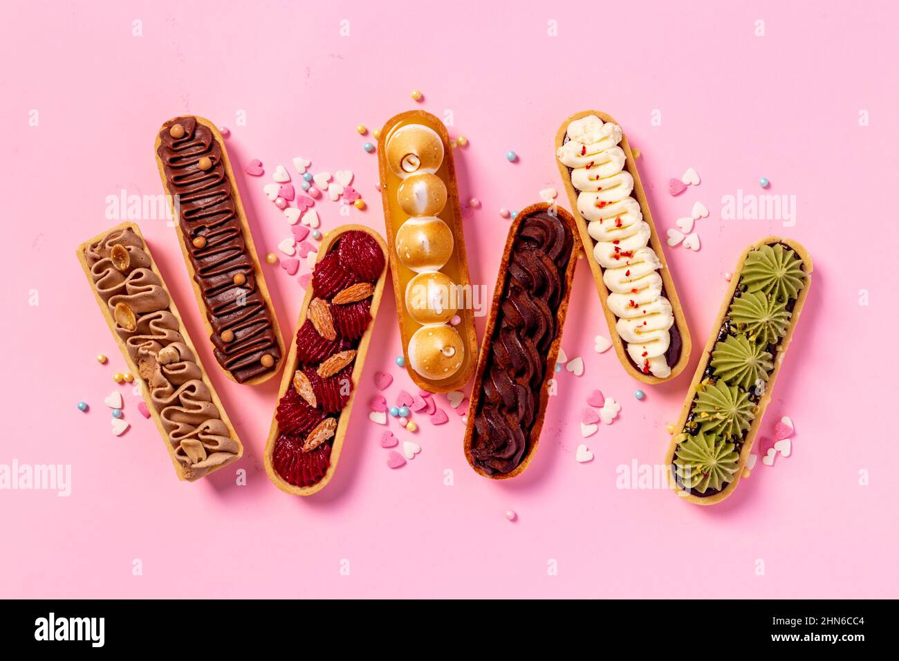 Sweet food pattern of eclairs with color topping. Sweet shacks Stock ...
