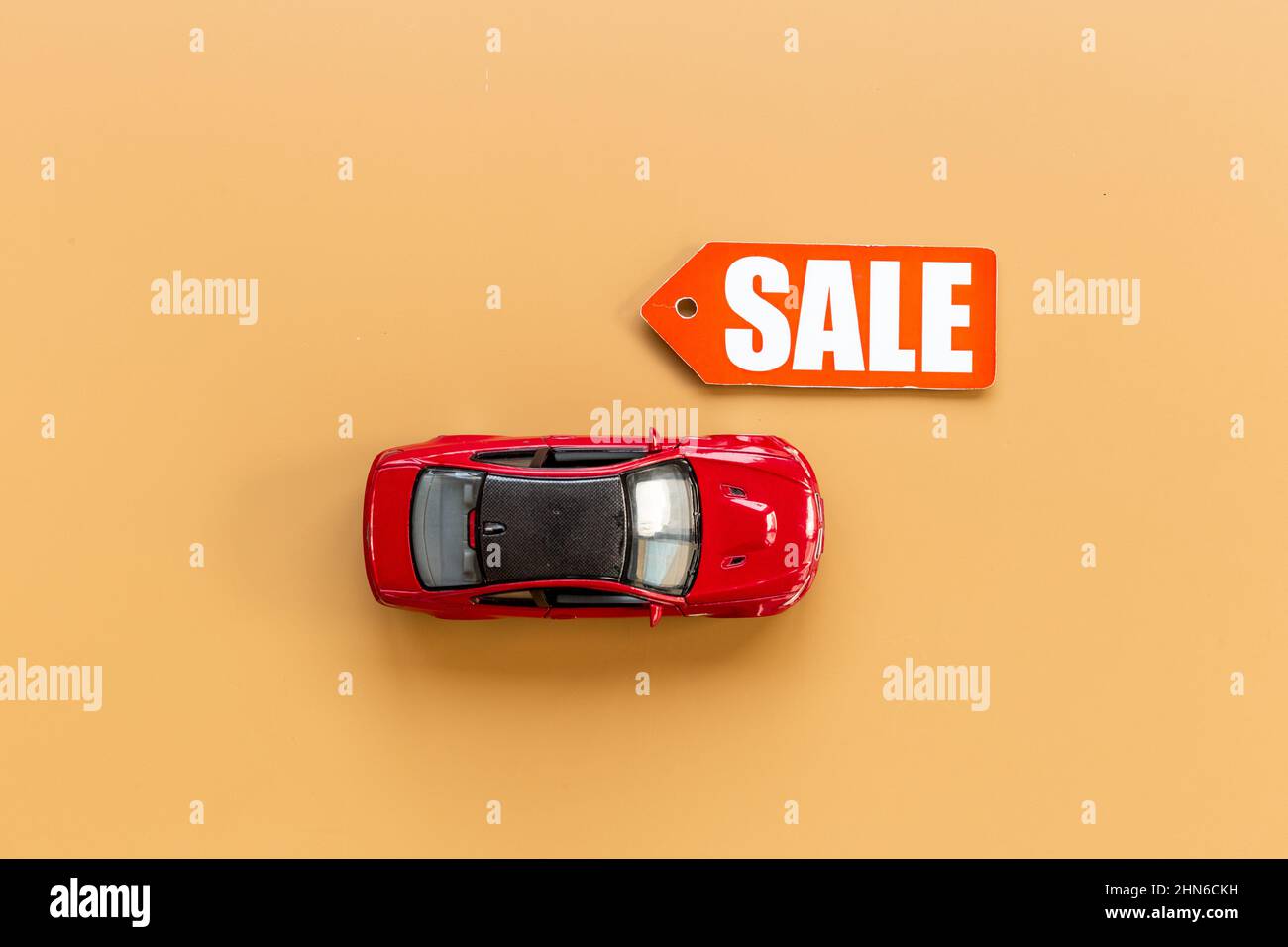 Sale label with small car model - sale of cars concept Stock Photo - Alamy