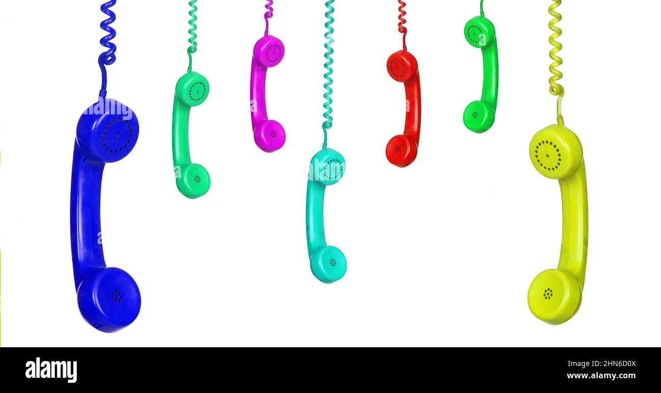 Colored phones hanging isolated on a white background Stock Photo - Alamy
