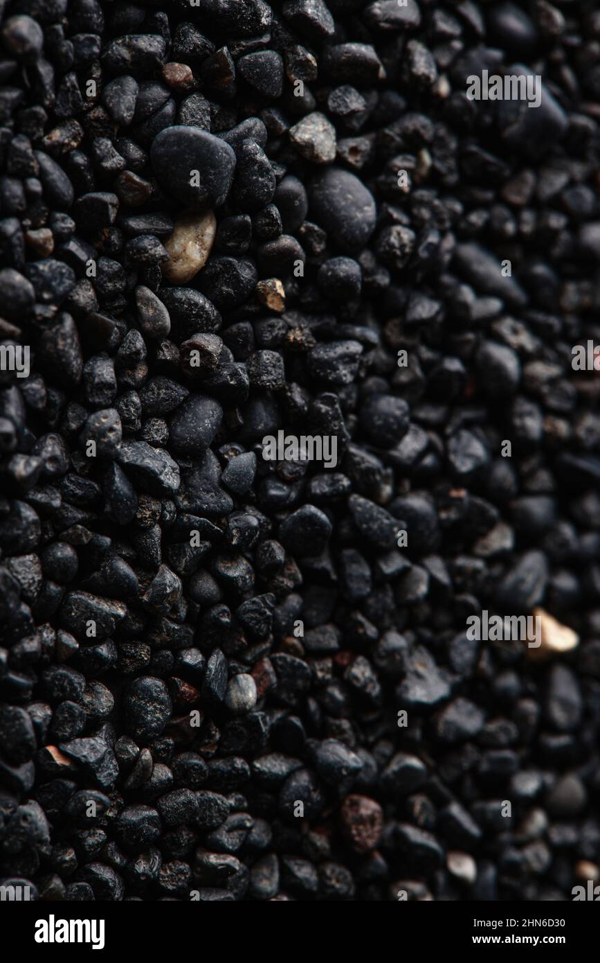 Texture of black volcanic sand for background. Black Sand beach macro ...