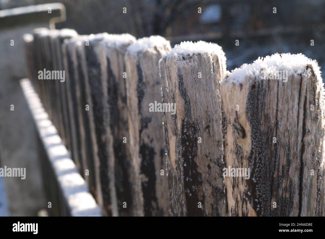 Wooden fence covered in snow Stock Photo - Alamy