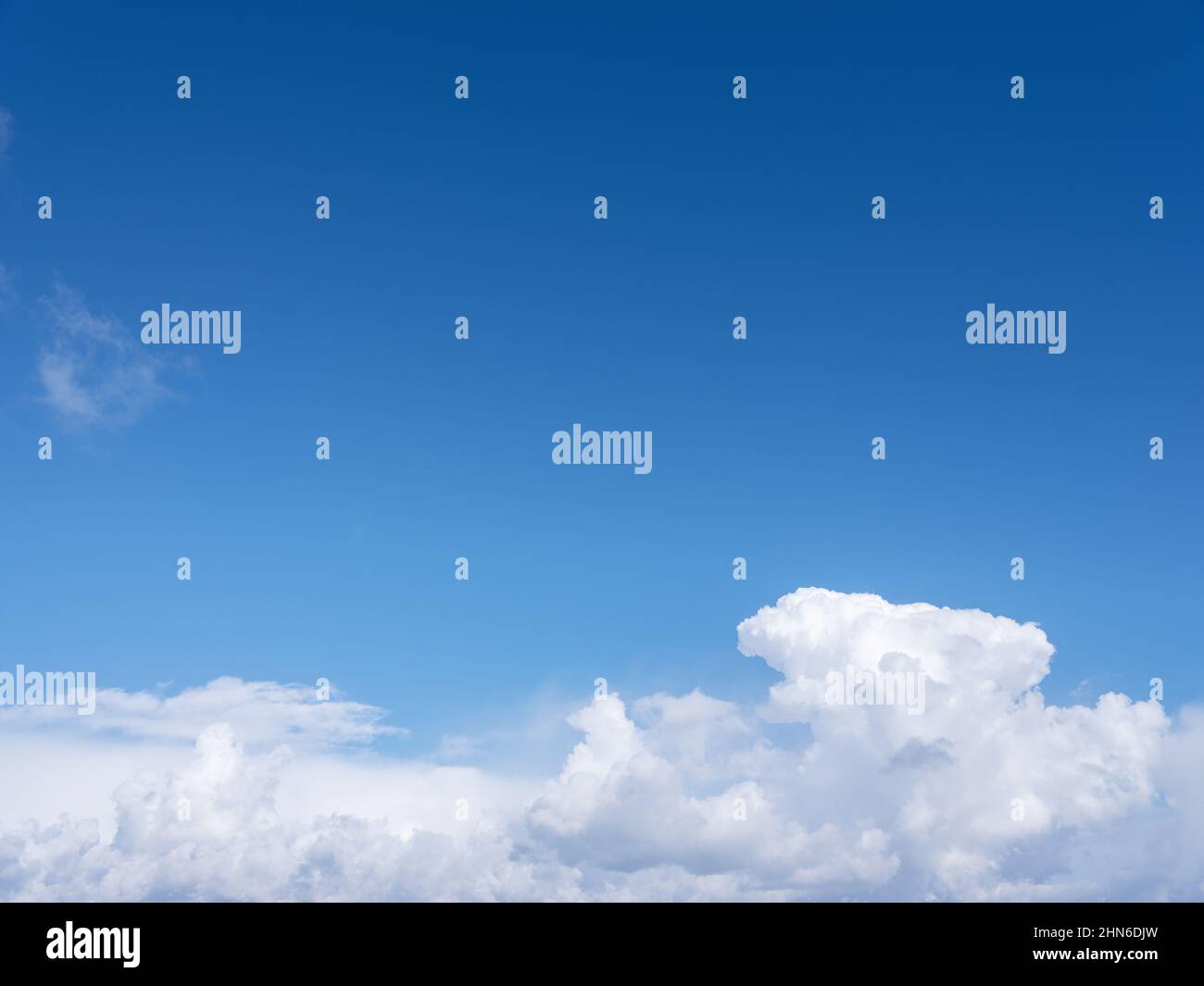 Fluffy white clouds and blue sky Stock Photo - Alamy