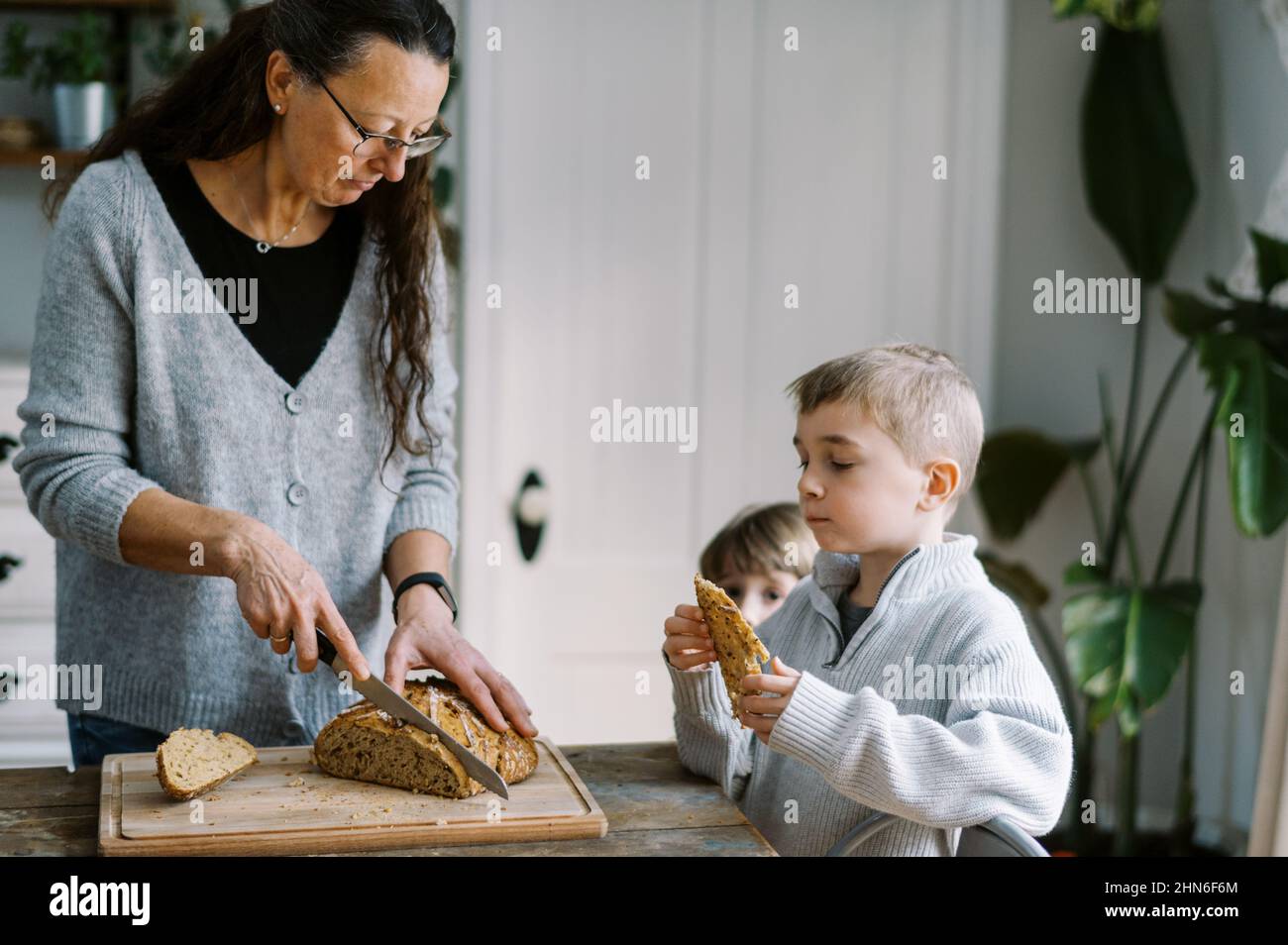 Boy eating bread vintage hi-res stock photography and images - Alamy