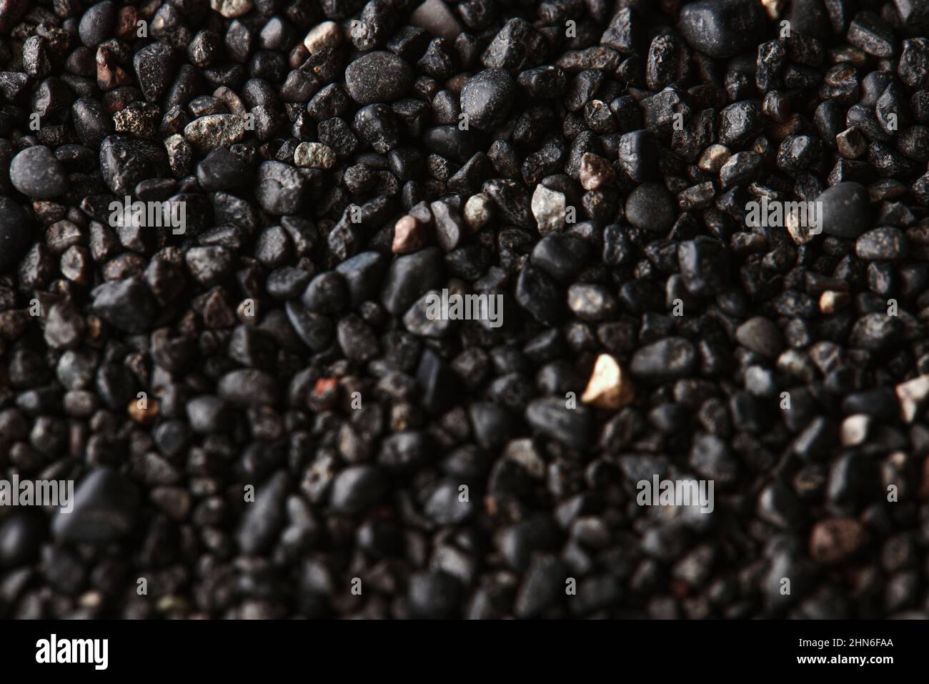 Texture of black volcanic sand for background. Black Sand beach macro ...
