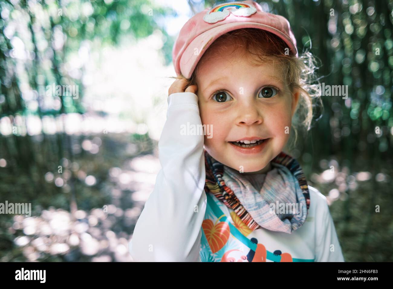 Girl looking happy wandering around in a bamboo forest Stock Photo - Alamy