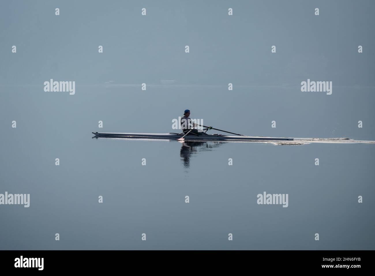 Como, 5 February 2022: Young man training rowing on the lake - Lake ...