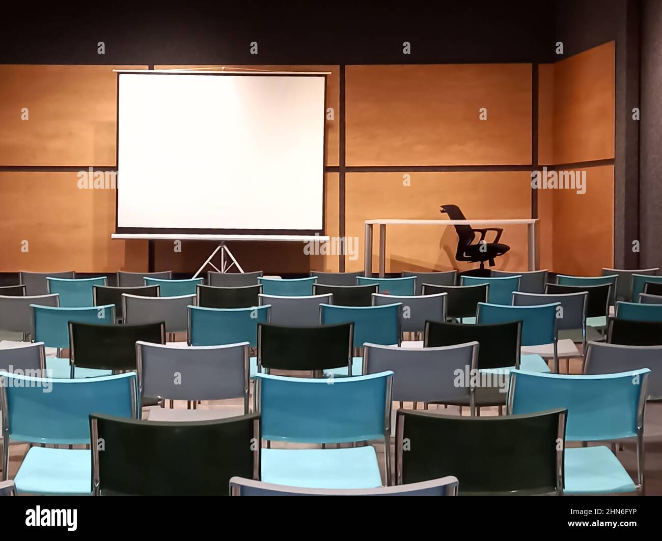 modern empty classroom with chairs and a blank whiteboard for mockup ...