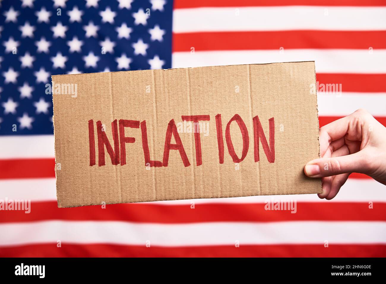 World Economic Crisis And Inflation Concept Woman Hold Paper Sheet