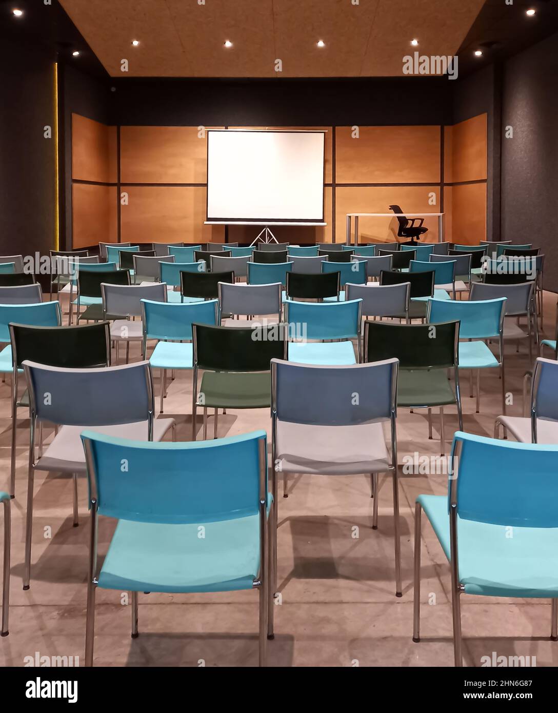 modern empty classroom with chairs and a blank whiteboard for mockup ...