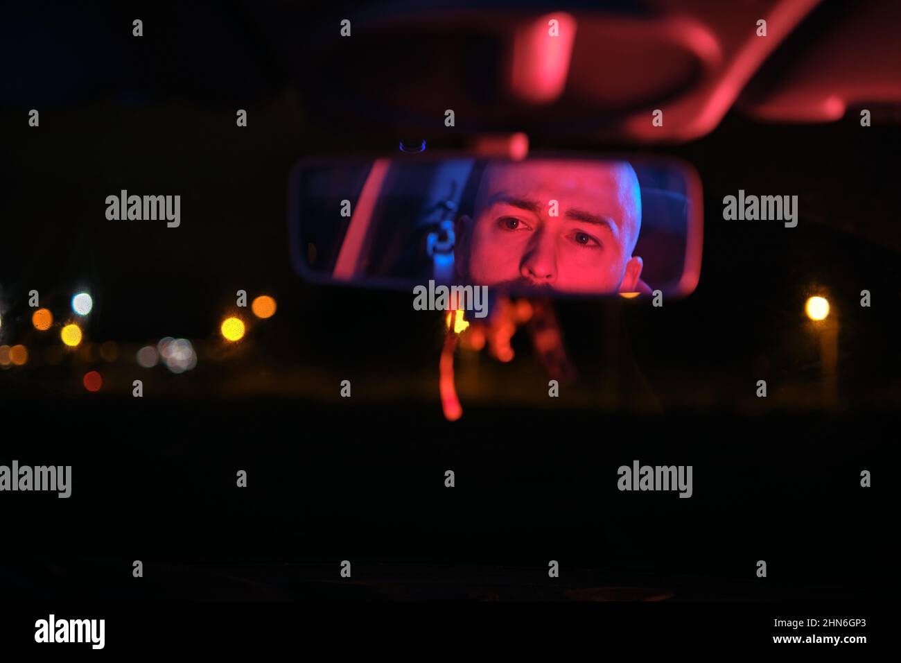 Portrait of a man in a car reflected in the rear view mirror Stock ...