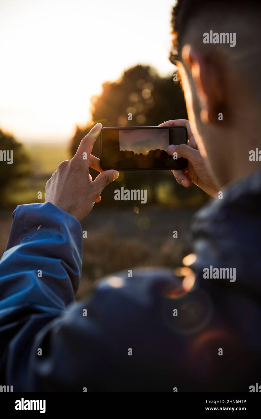 Hands of a young boy taking a photo with a smartphone Stock Photo - Alamy