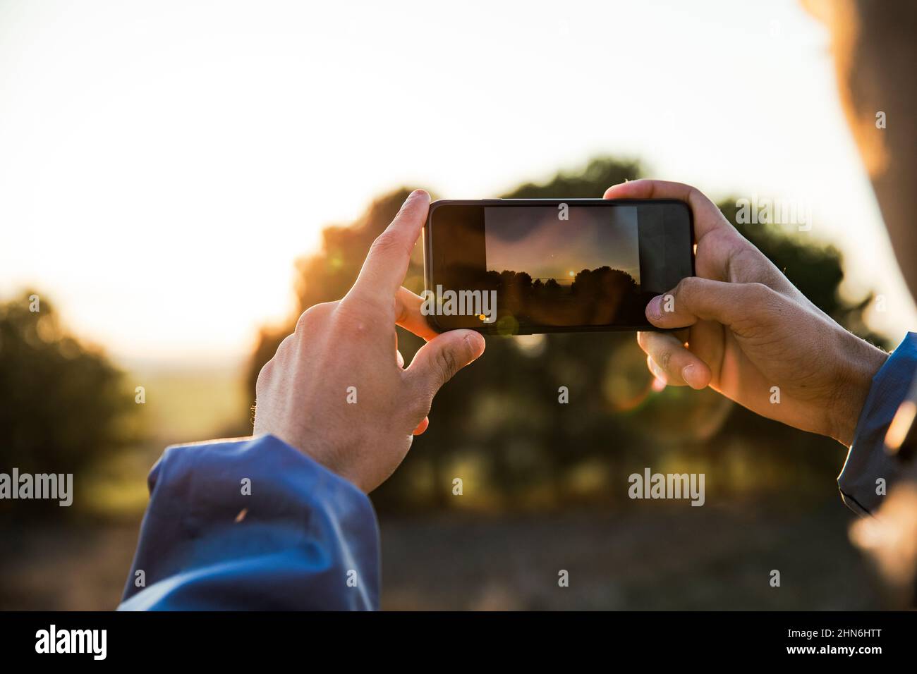 Hands of a young boy taking a photo with a smartphone Stock Photo - Alamy