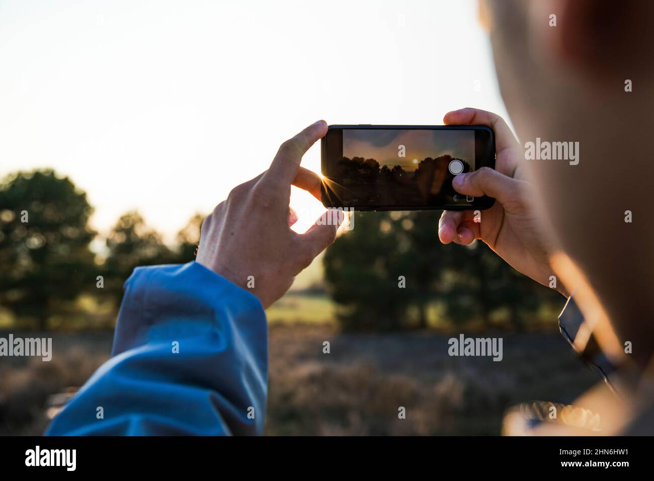 Hands of a young boy taking a photo with a smartphone Stock Photo - Alamy