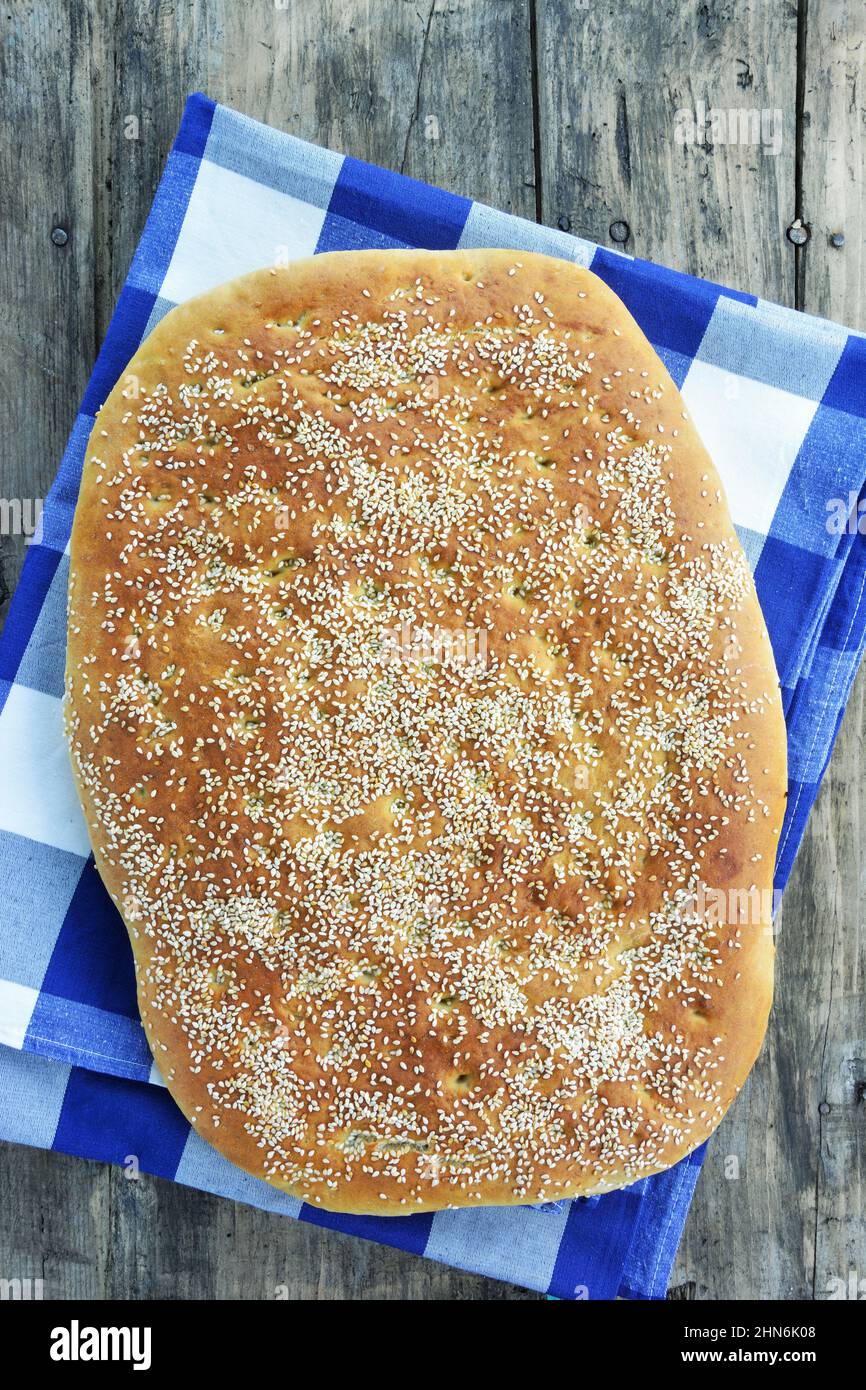 Flatbread known as lagana bread on checkered towel Stock Photo - Alamy