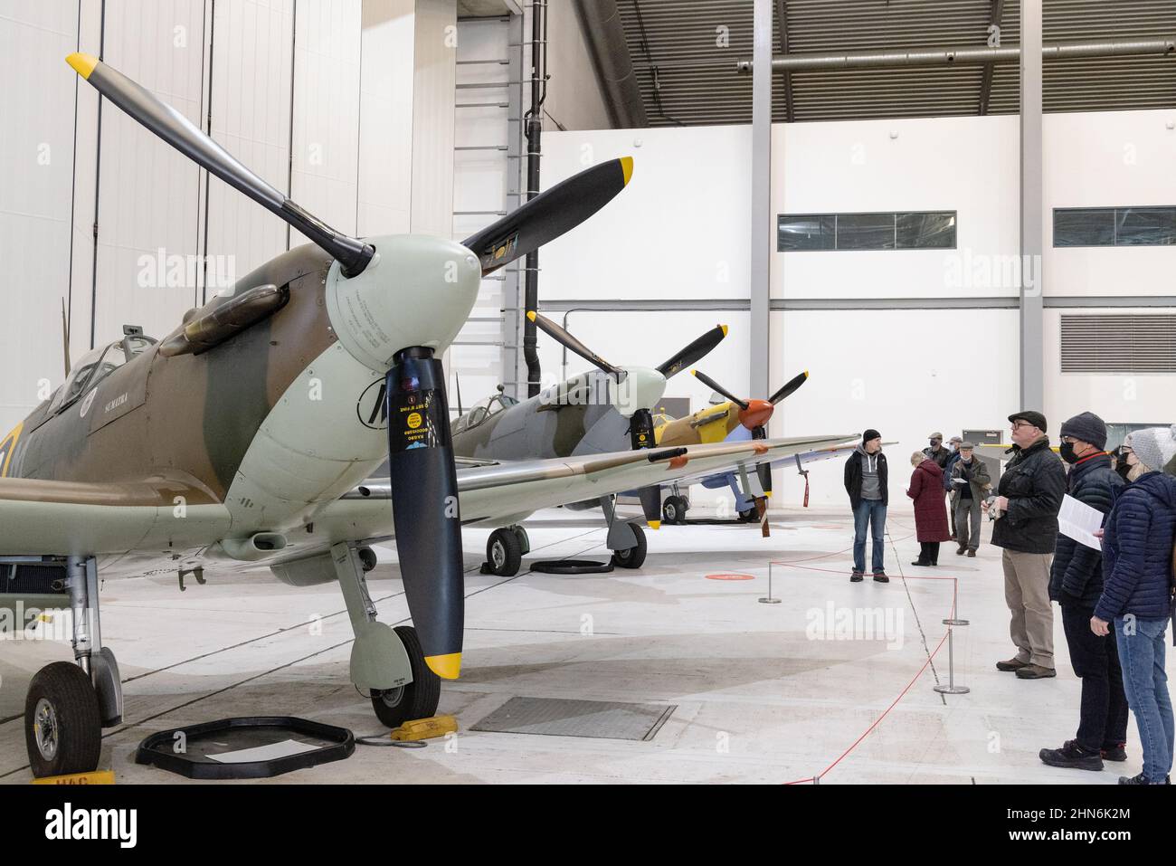 Imperial War Museum Duxford UK - people looking at an exhibition of ...