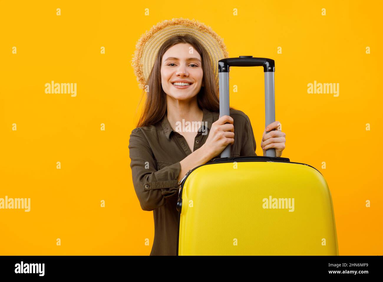 Cheerful Lady Tourist Posing With Suitcase Wearing Hat, Yellow ...