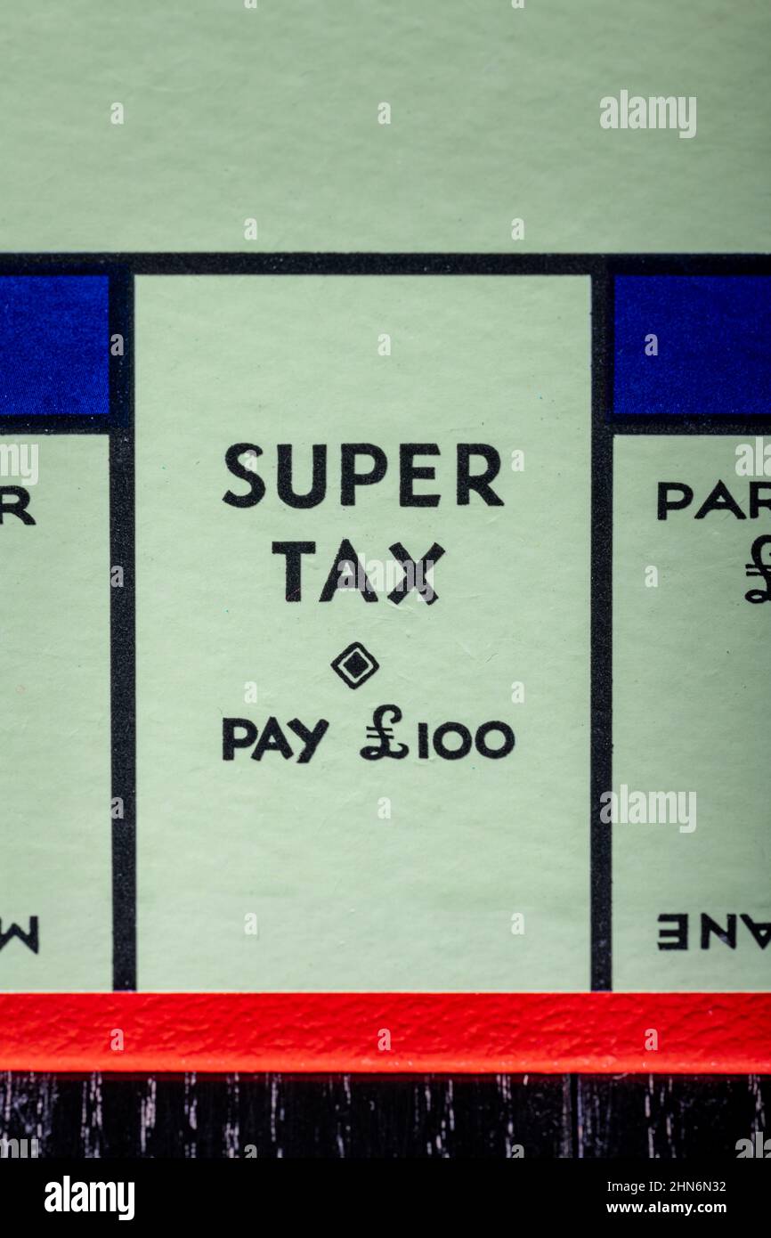 The Pay Supertax Square on a UK monopoly board Stock Photo - Alamy