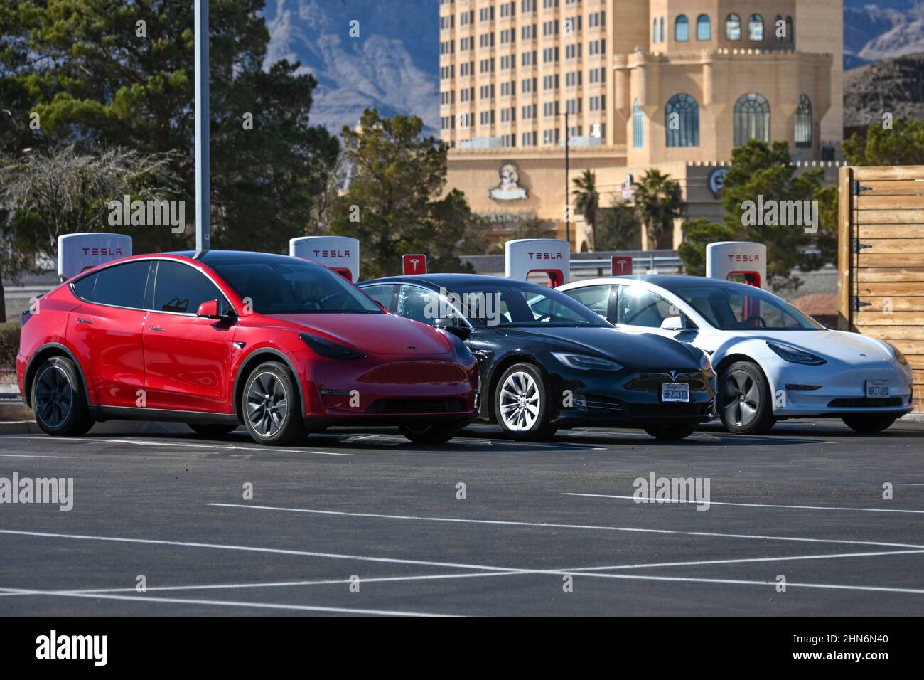 Tesla Model Y, Model S, and Model 3 cars are seen charging at Tesla ...