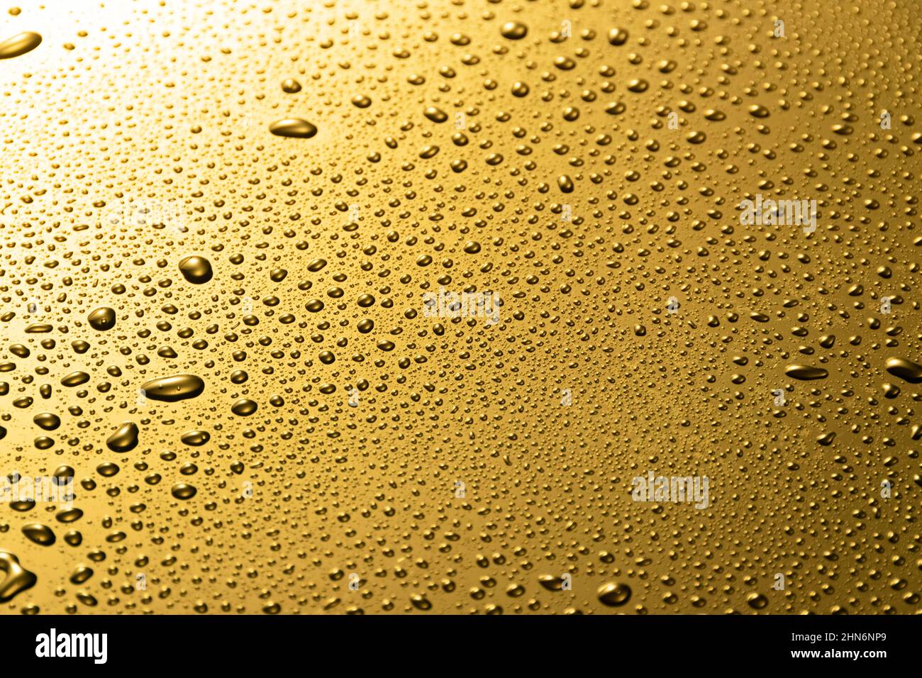 Golden metal water drops on shiny metallic surface Stock Photo - Alamy