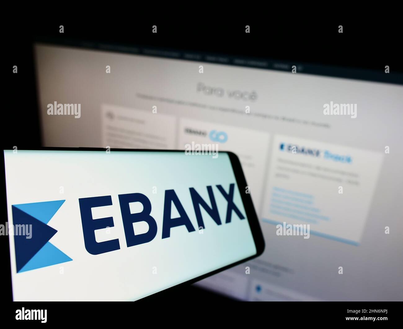 Cellphone with logo of Brazilian payment services company Ebanx S.A. on ...