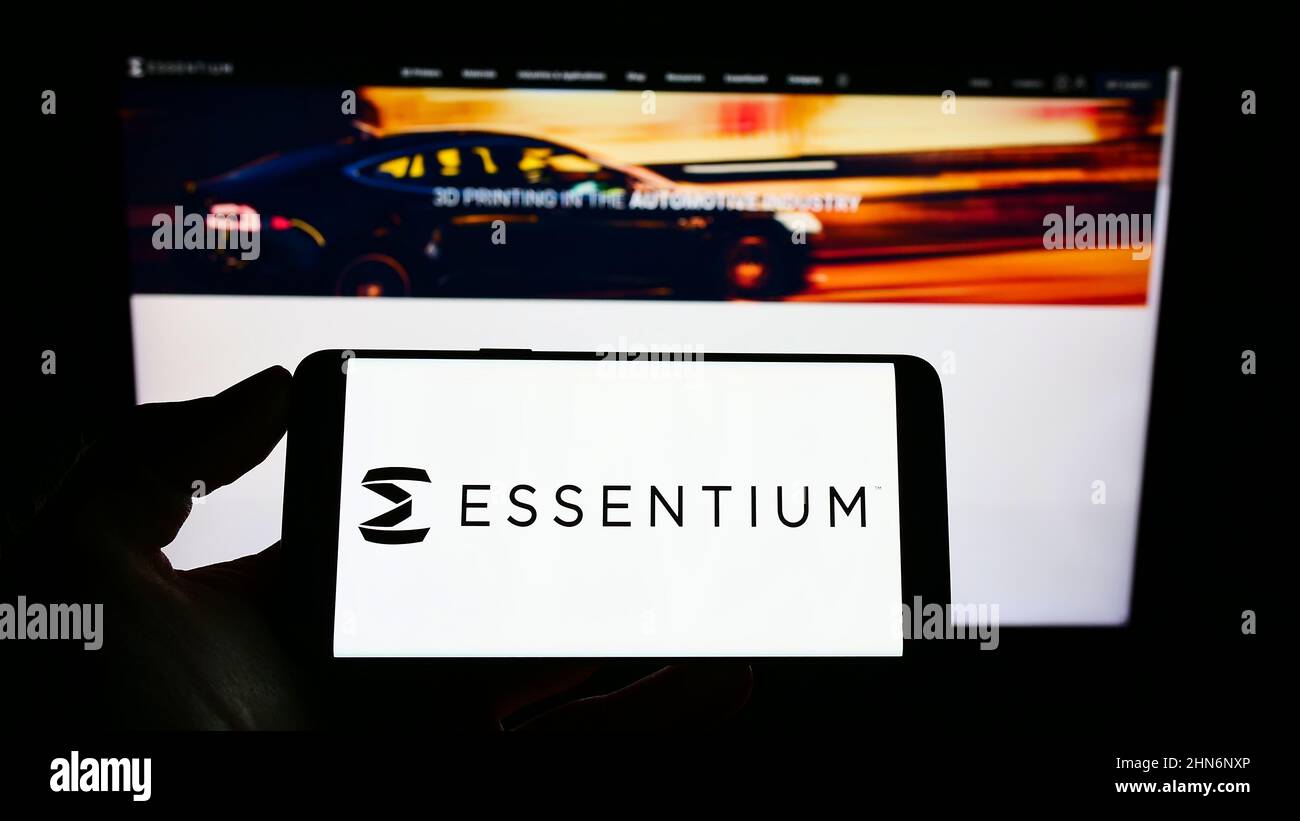 Person holding mobile phone with logo of American 3D printing company ...