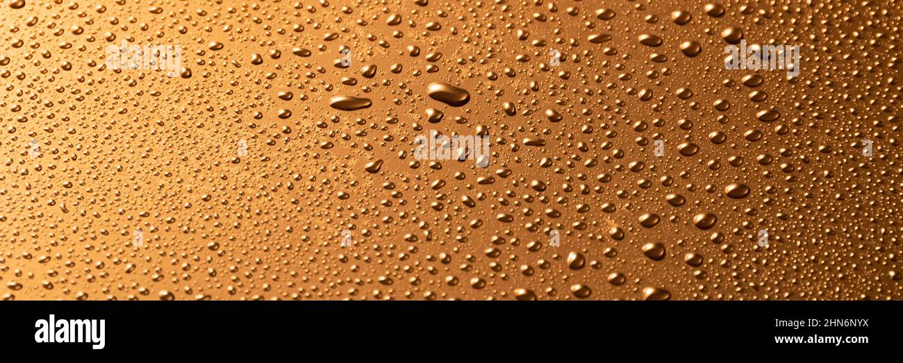 Golden metal water drops on shiny metallic surface Stock Photo - Alamy