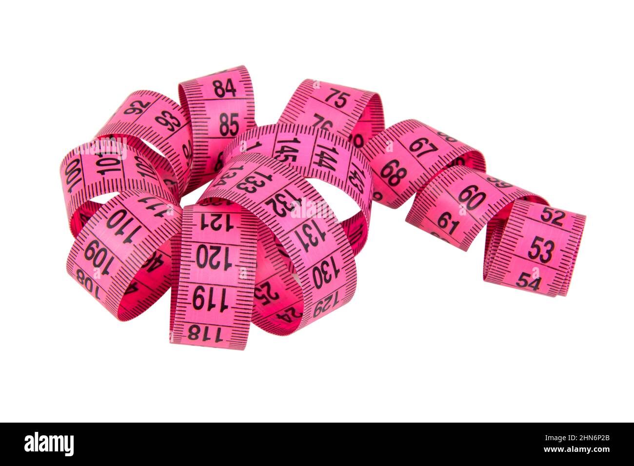 Pink tape measure roll isolated on the white background Stock Photo - Alamy